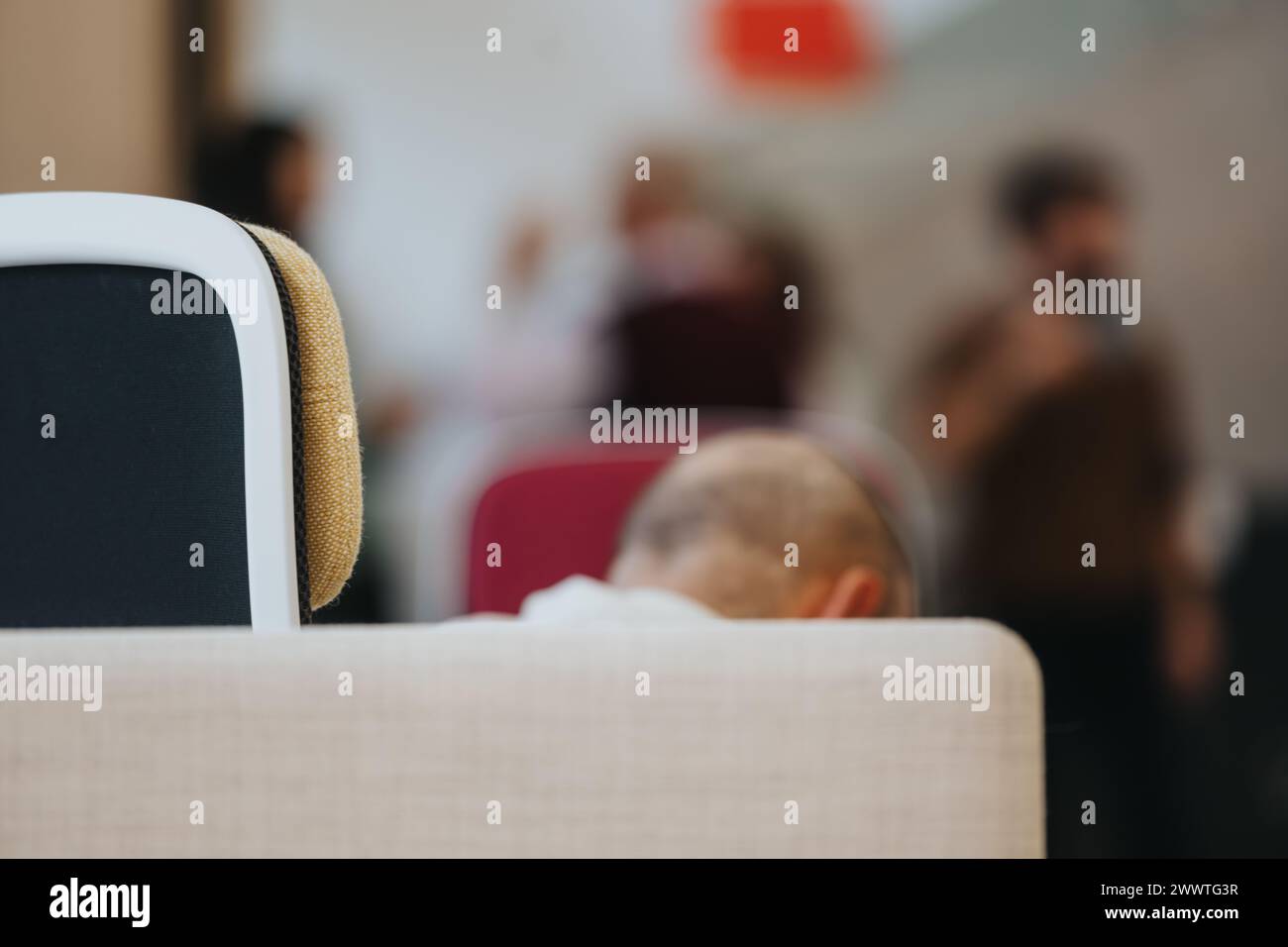 Business seminar audience perspective with participants and speaker ...