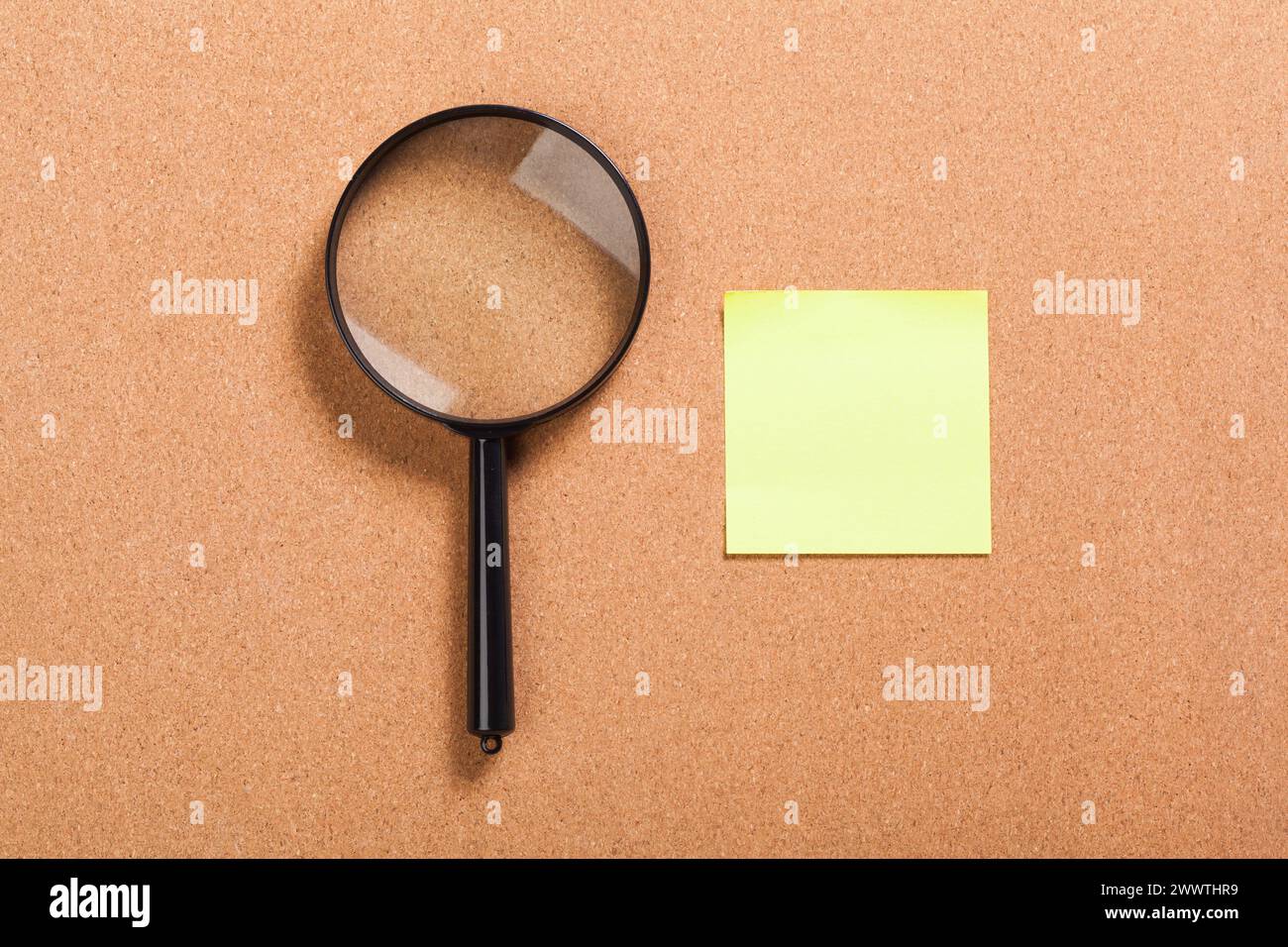Black magnifying glass, yellow sticky blank notes Stock Photo - Alamy