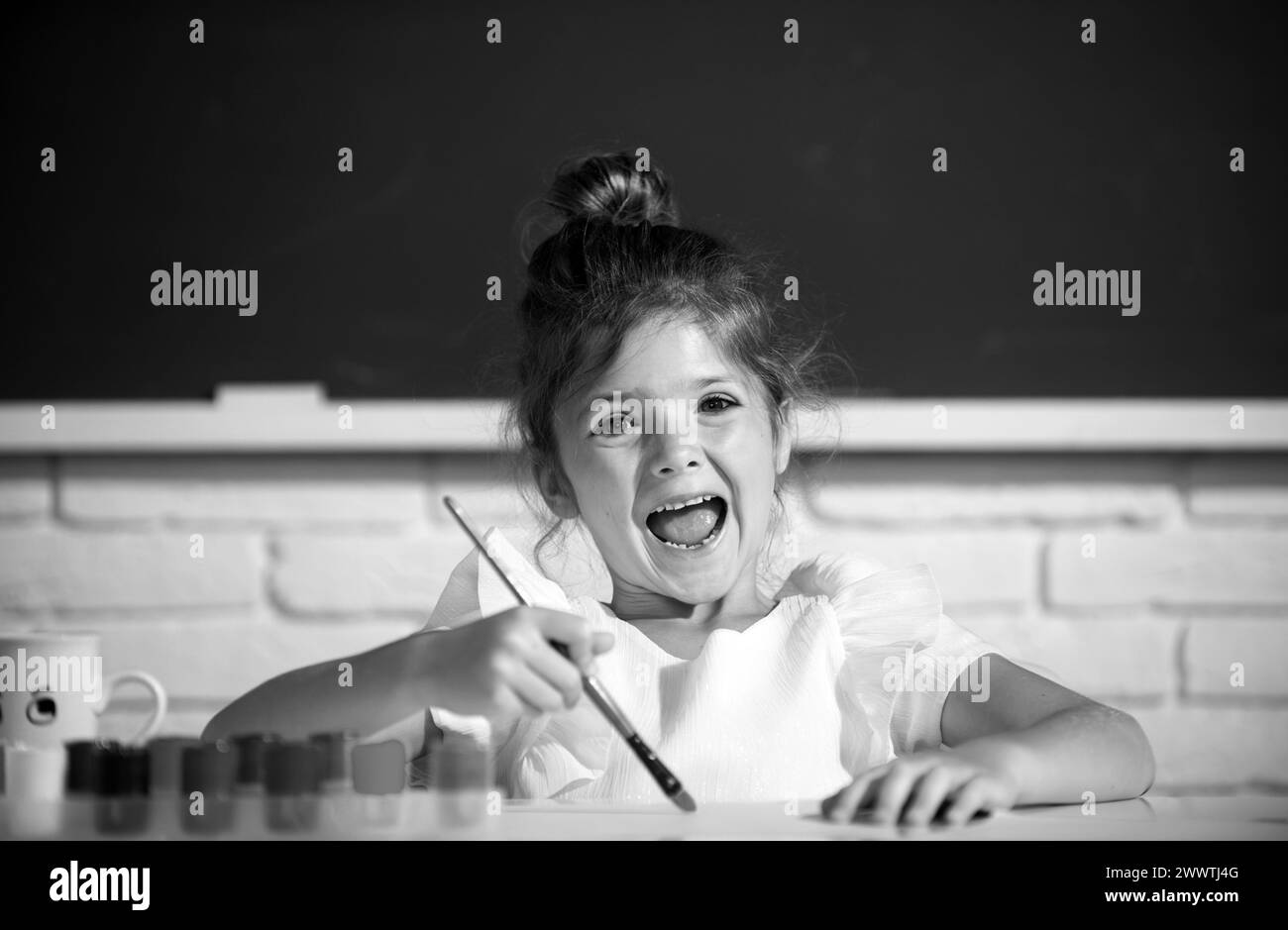 Painting school lesson, drawing art. Portrait of adorable little girl ...