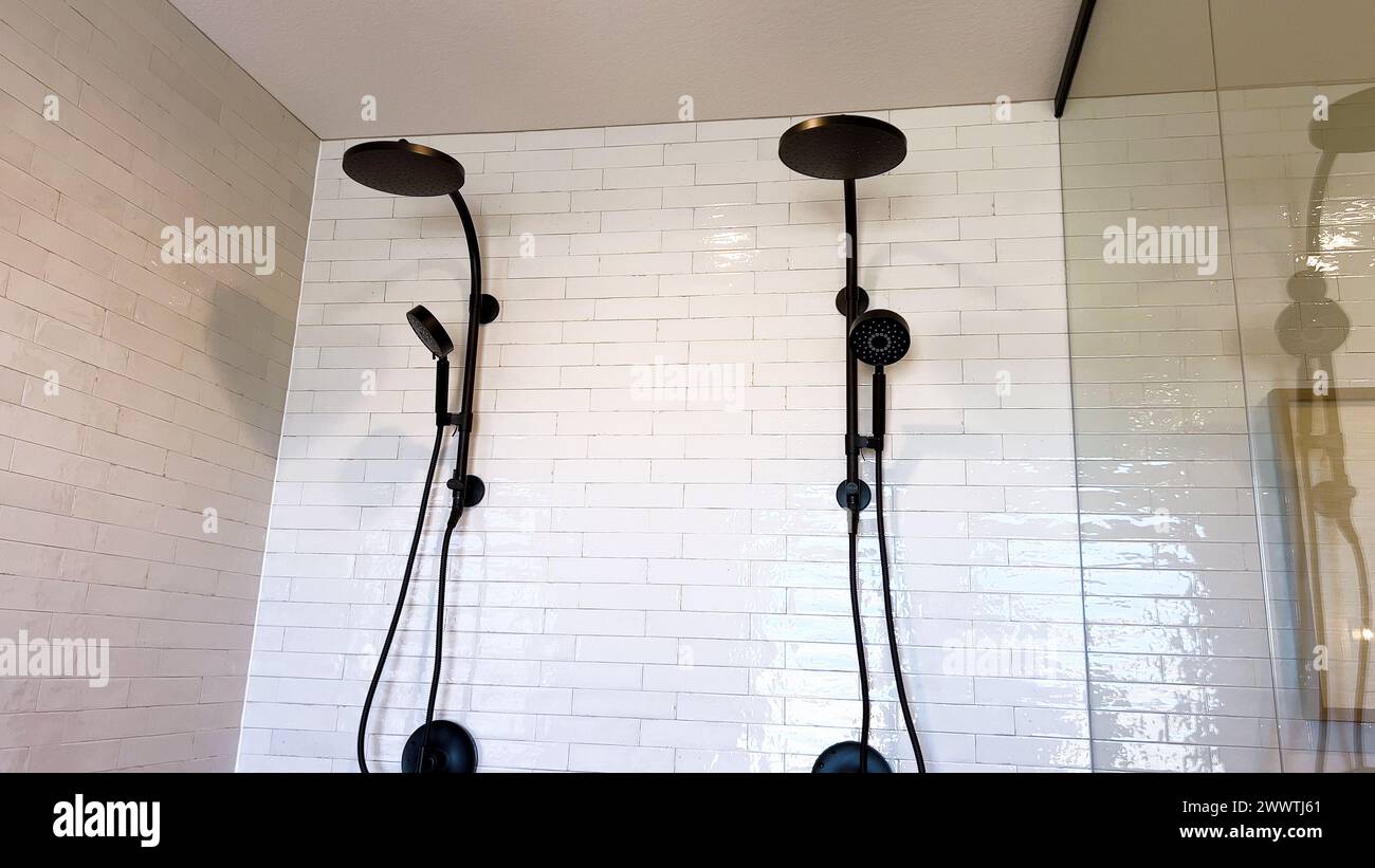 Elegant Bathroom with Dual Showerheads and Subway Tiles Stock Photo - Alamy