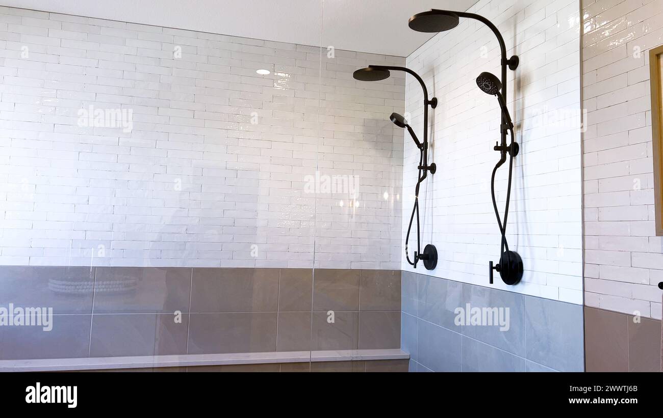 Elegant Bathroom with Dual Showerheads and Subway Tiles Stock Photo - Alamy