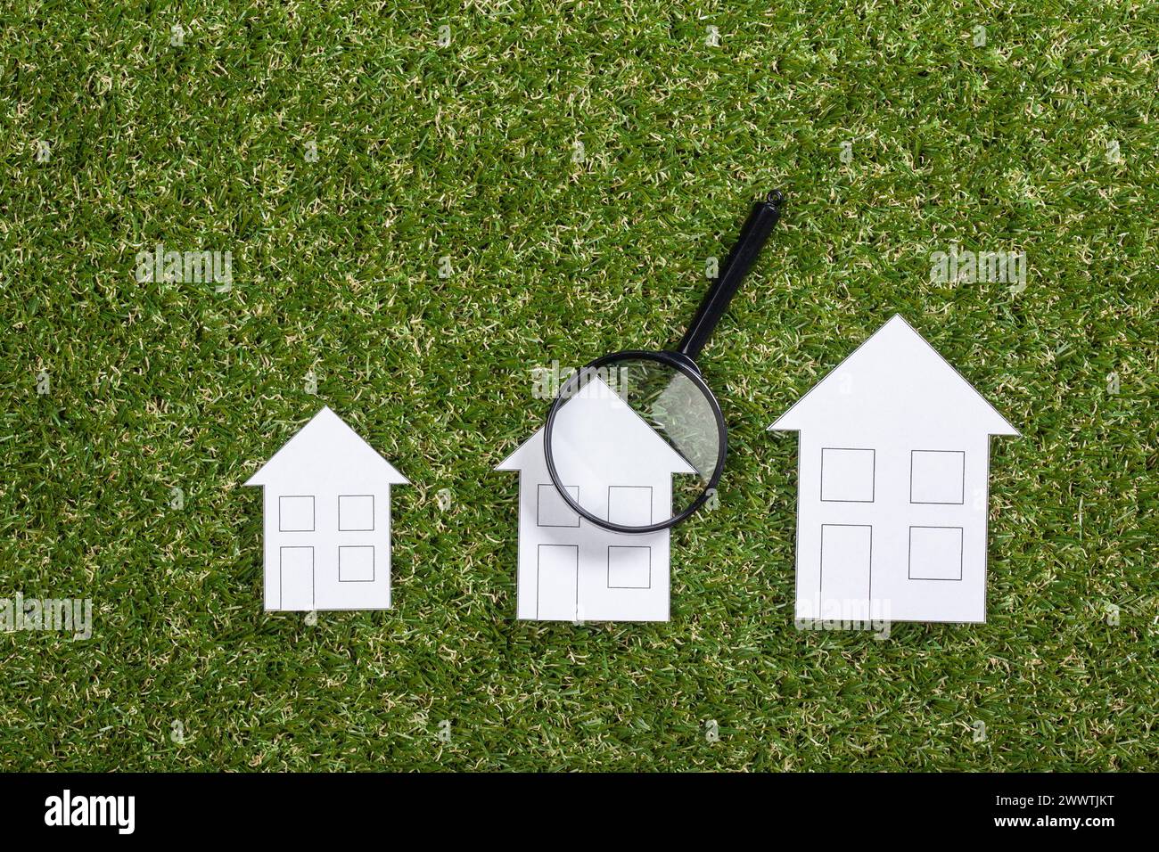 paper house with Magnifying Glass Stock Photo - Alamy