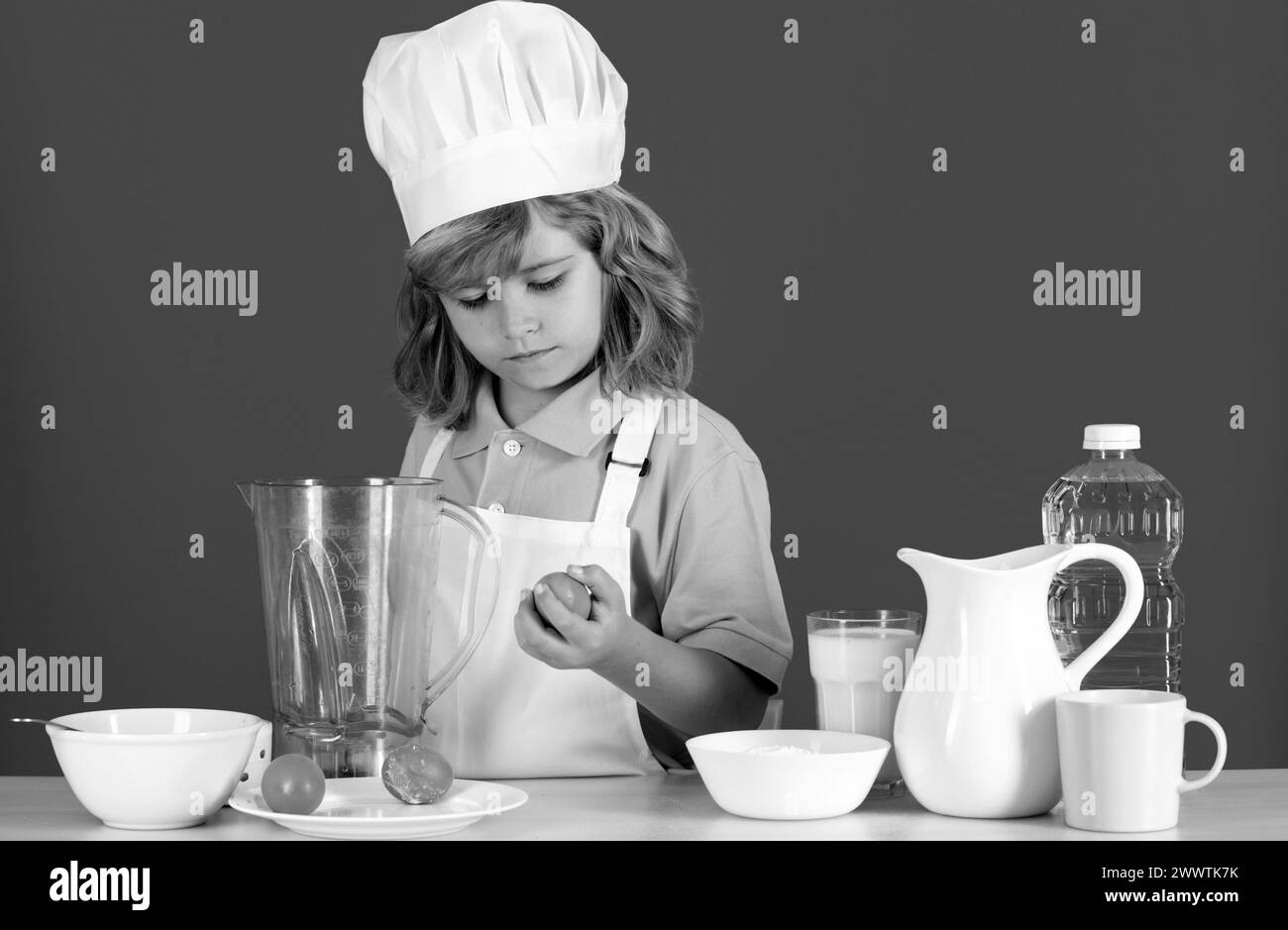 Child chef isolated on blue. Funny little kid chef cook wearing uniform ...