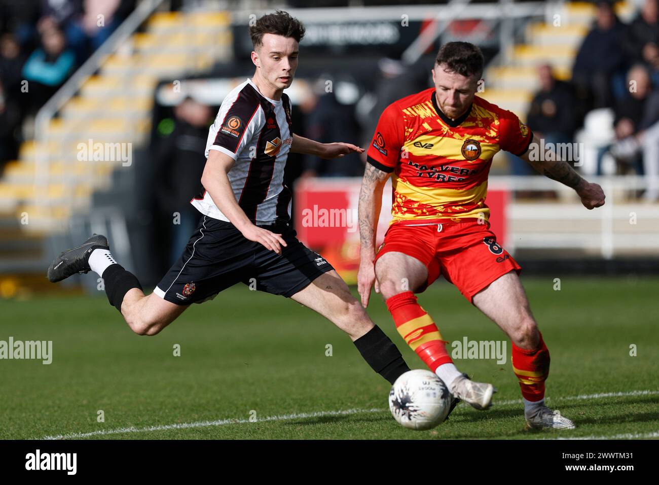 Gloucester City's Louis McGrory clears from Spennymoor Town's Corey ...