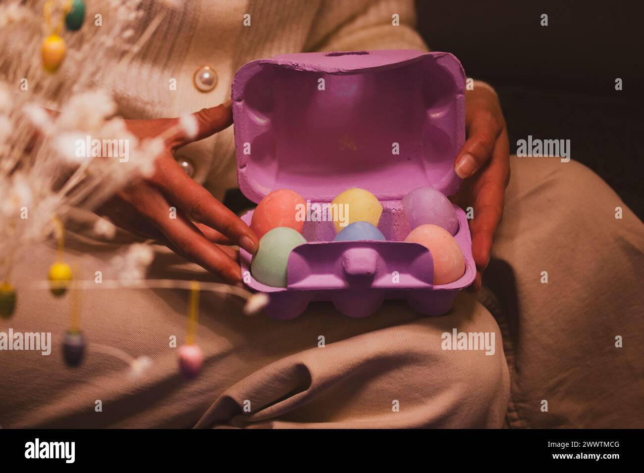 Collection of beautifully painted Easter eggs nestled in a violet box ...