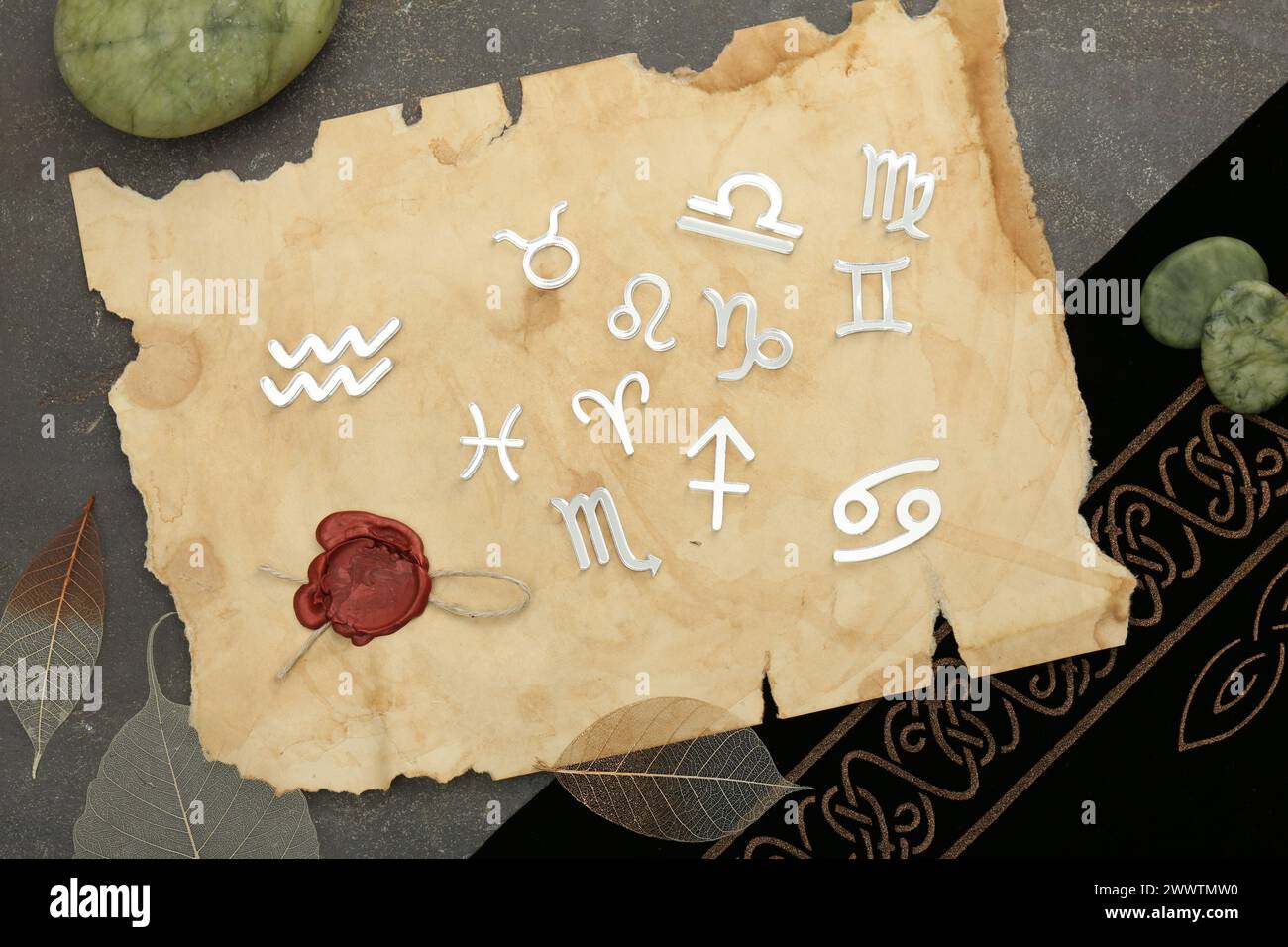 Flat lay composition with zodiac signs on grey textured table Stock ...