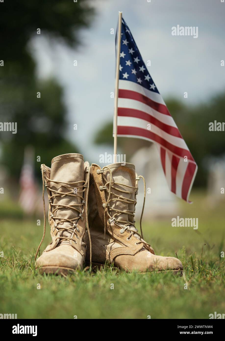 Old military combat boots against American flag in the background ...