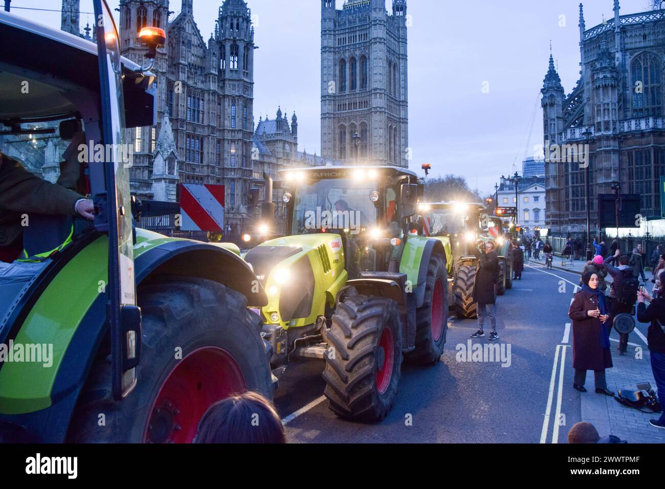 London, UK. 25th Mar, 2024. British farmers in tractors stage a protest ...