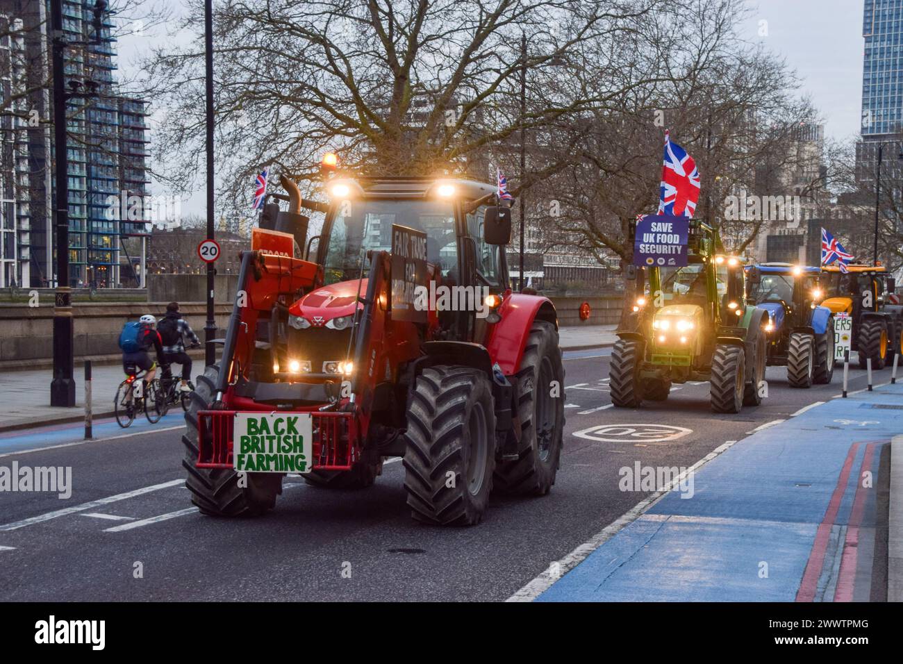 London, UK. 25th Mar, 2024. British farmers in tractors stage a protest ...