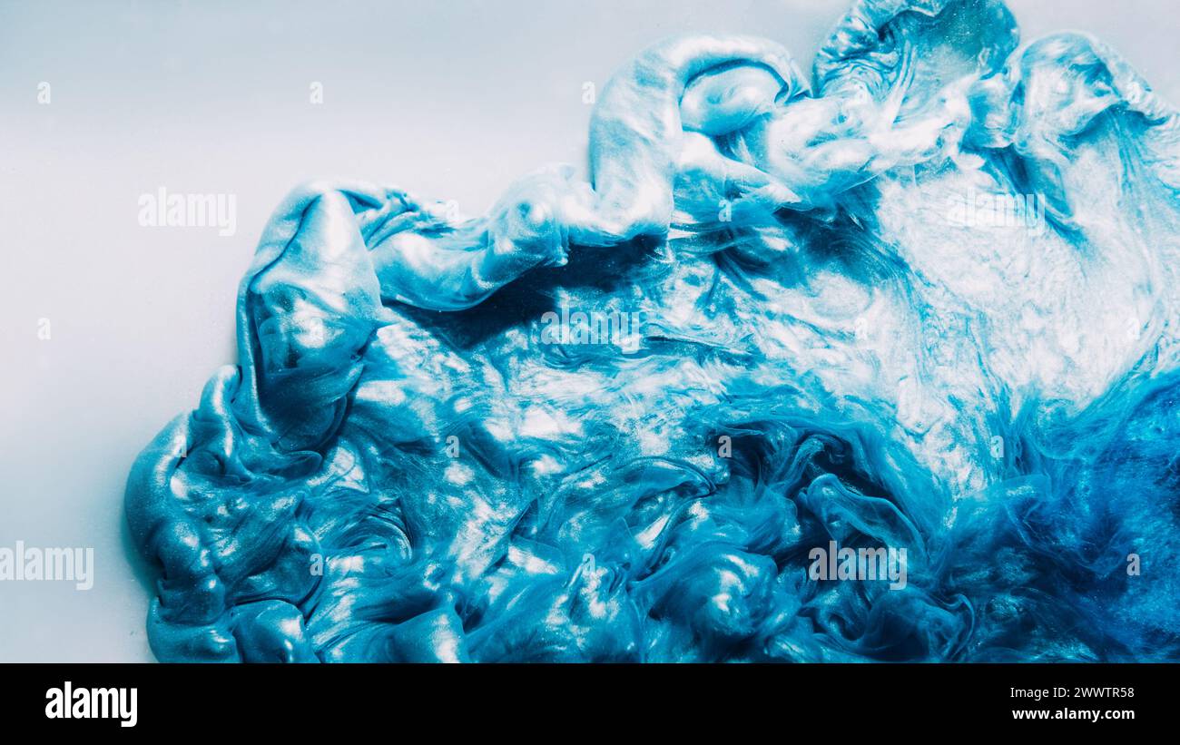 Ink drop glitter fluid smoke cloud blue paint blob Stock Photo - Alamy
