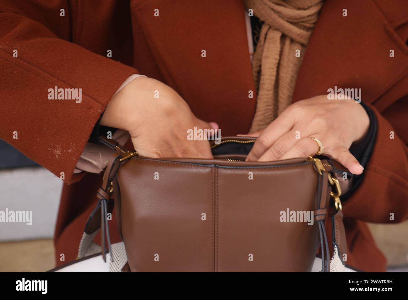 Girl looking something in purse hi-res stock photography and images - Alamy