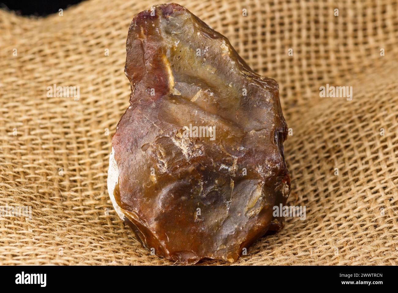 Stone scraper made of red-yellow chalcedony, Stone Age tool Stock Photo ...