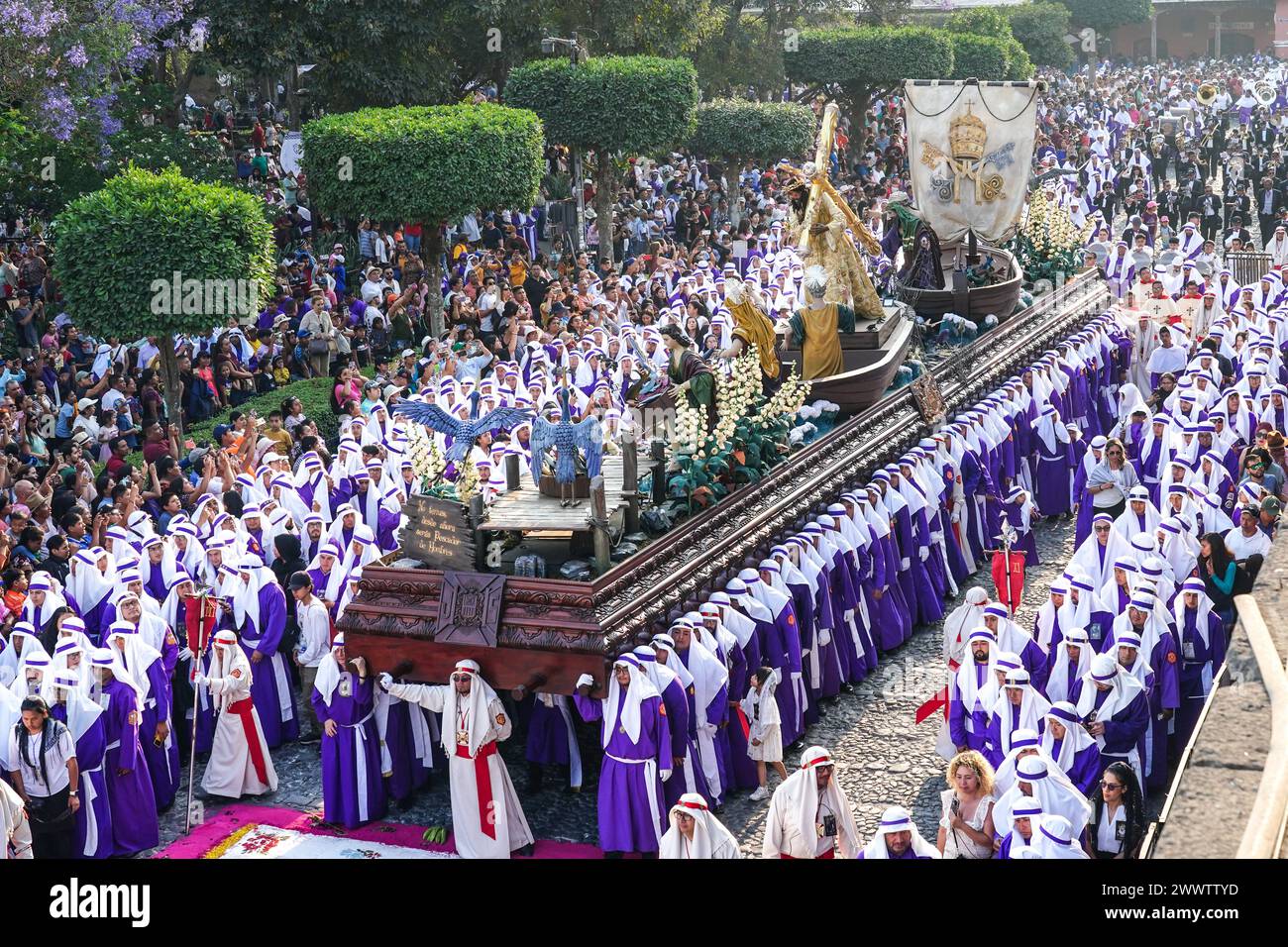 Antigua, Guatemala. 24th Mar, 2024. Catholic penitents surround the ...