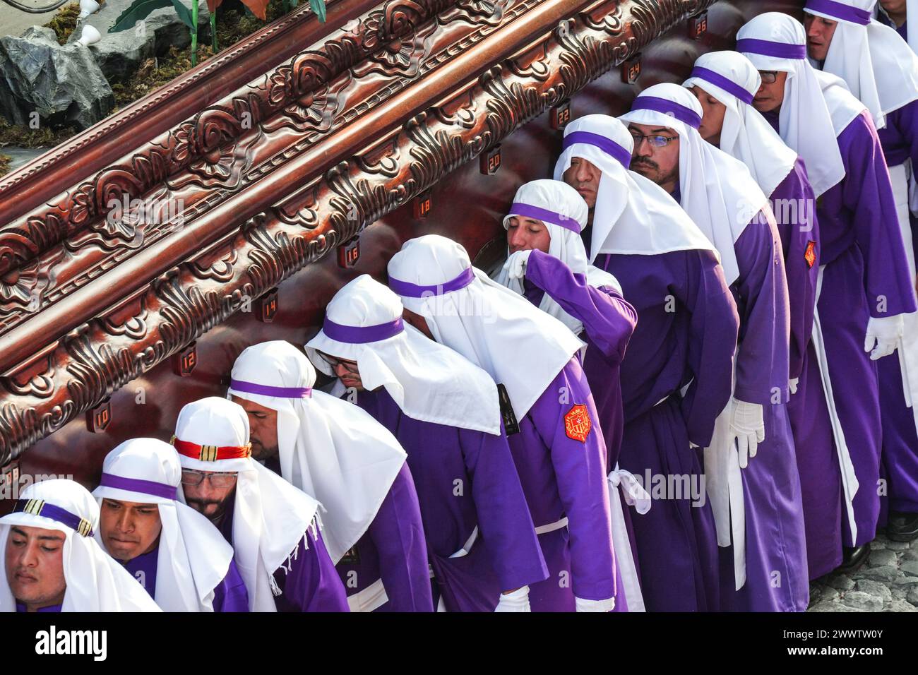 Antigua, Guatemala. 24 March, 2024. A Catholic penitent wipes away ...