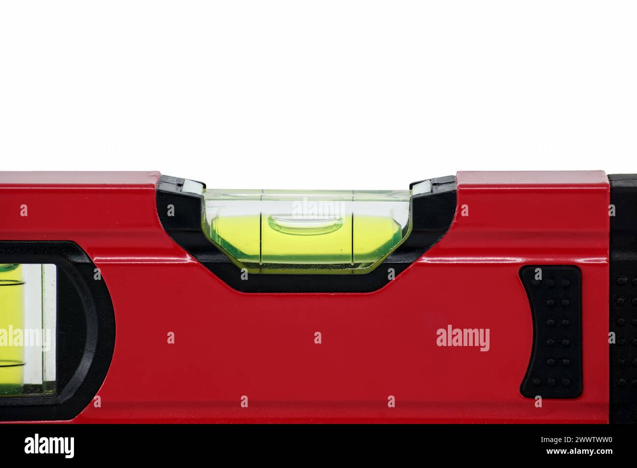 Red spirit level with a green bubble indicator is situated horizontally ...