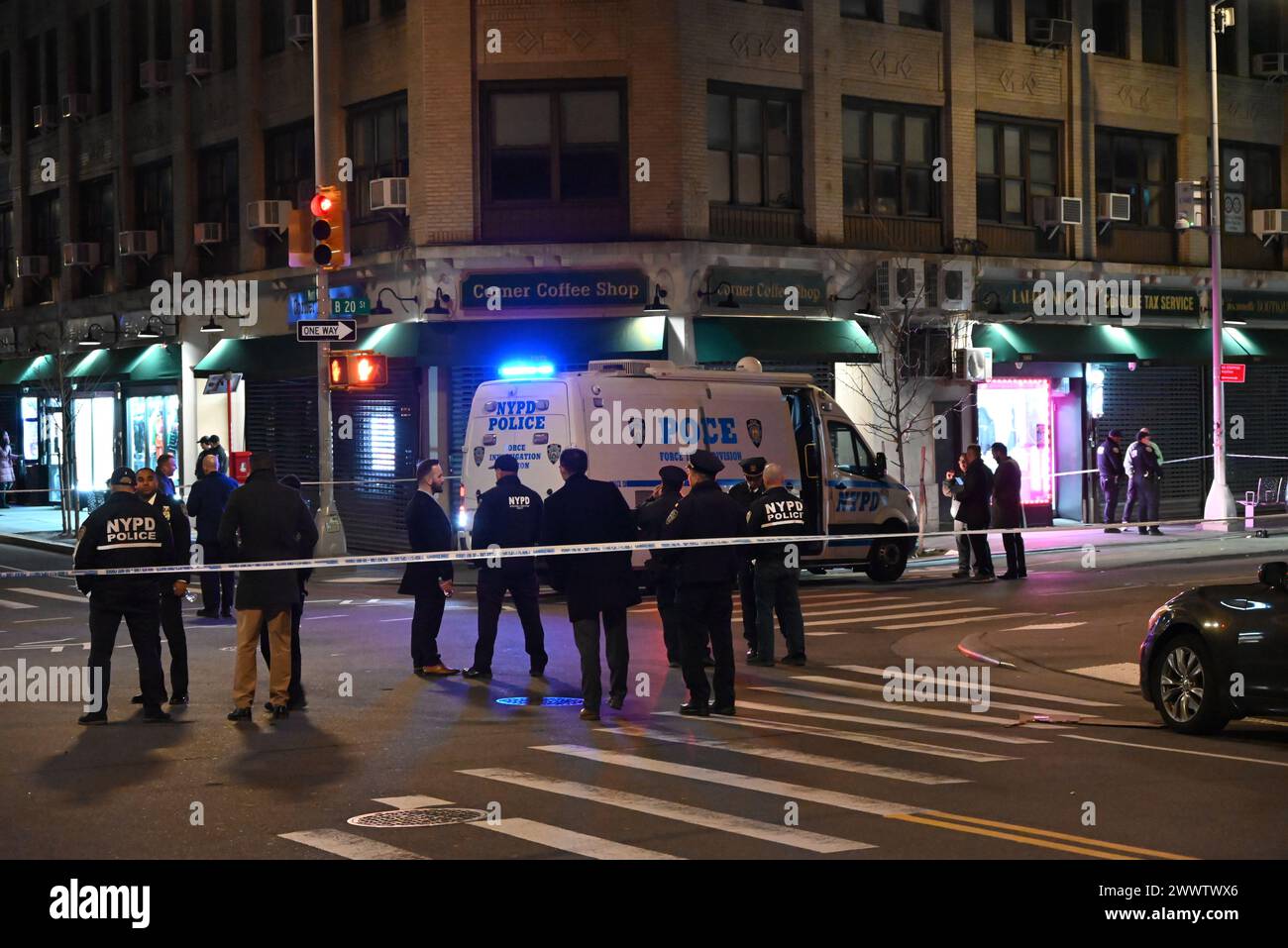 Queens, New York, USA. 25th Mar, 2024. Police close off roads and sidewalks at the scene of a ...
