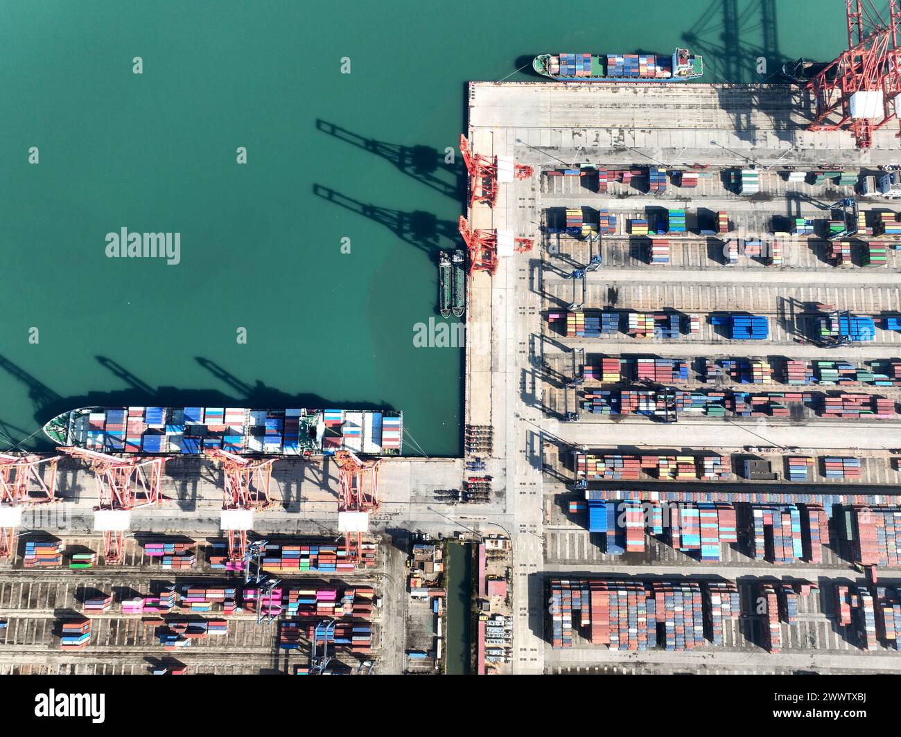 LIANYUNGANG, CHINA - MARCH 26, 2024 - A cargo ship stops at a berth to ...