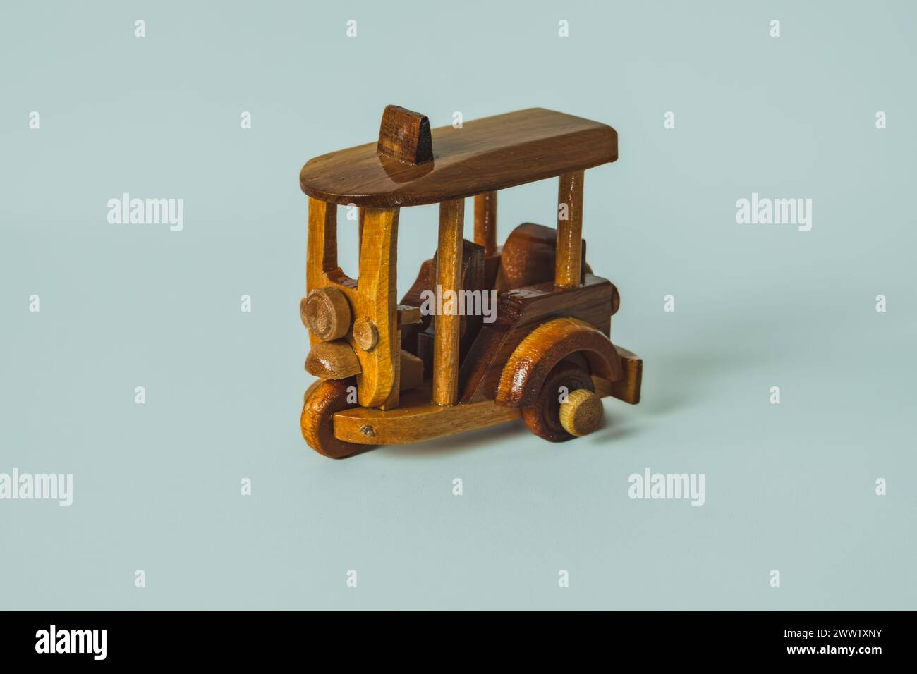 The car has three round wheels and a smooth, rectangular body. This ...