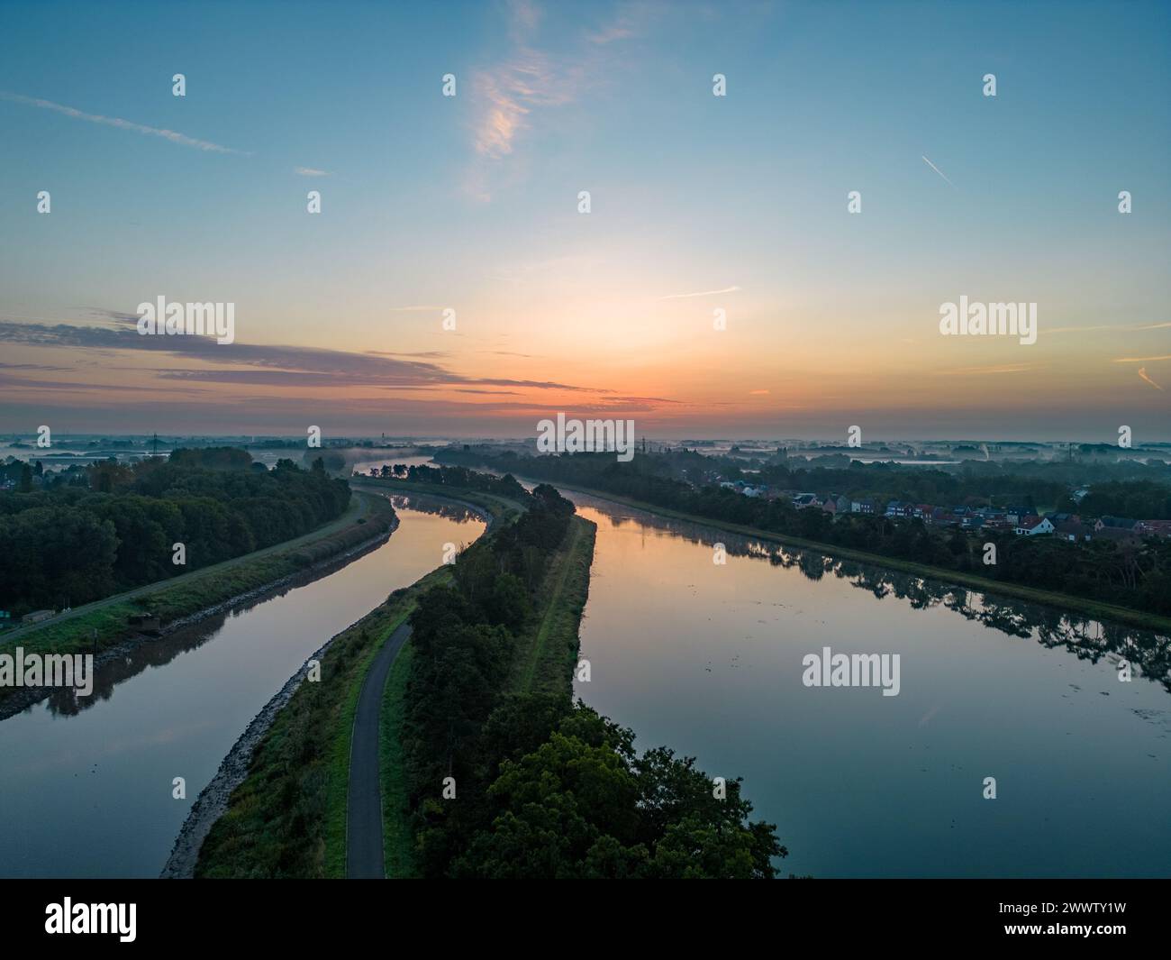 Captured at twilight, this serene aerial image presents a meandering ...