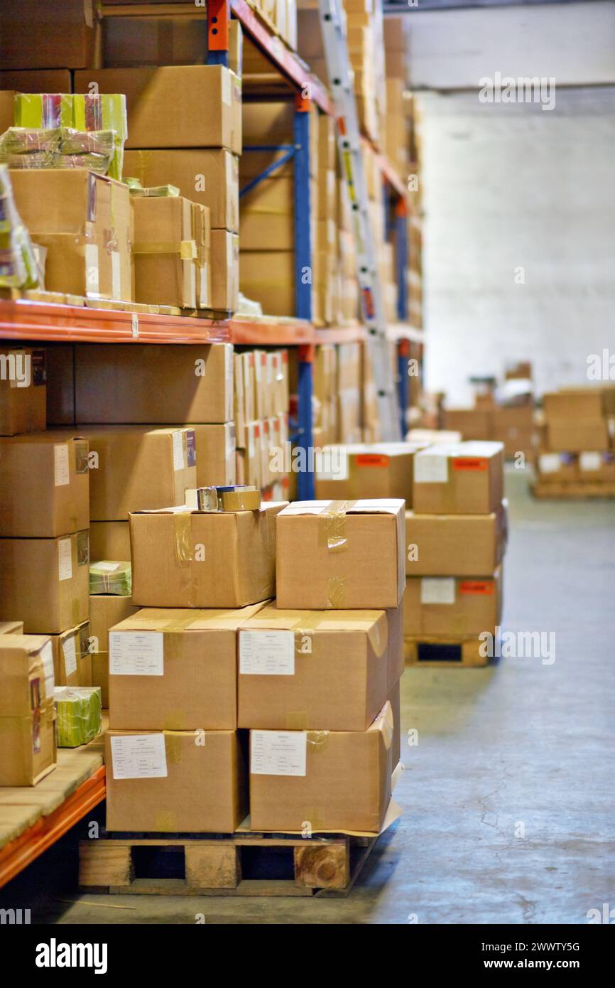 Boxes, packages and shelves with inventory at warehouse for ...