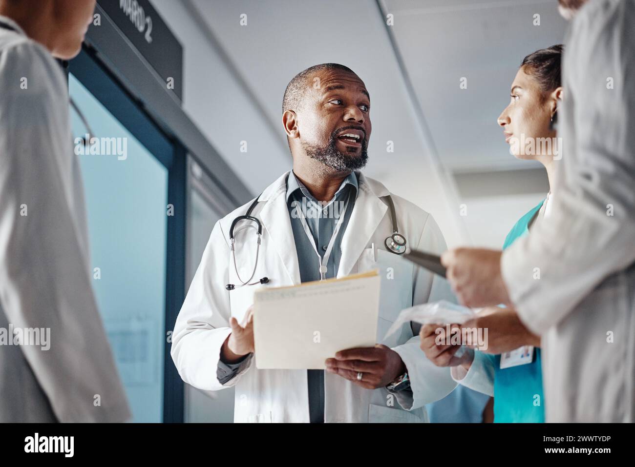Hospital, teamwork and doctor with folder, conversation and ...