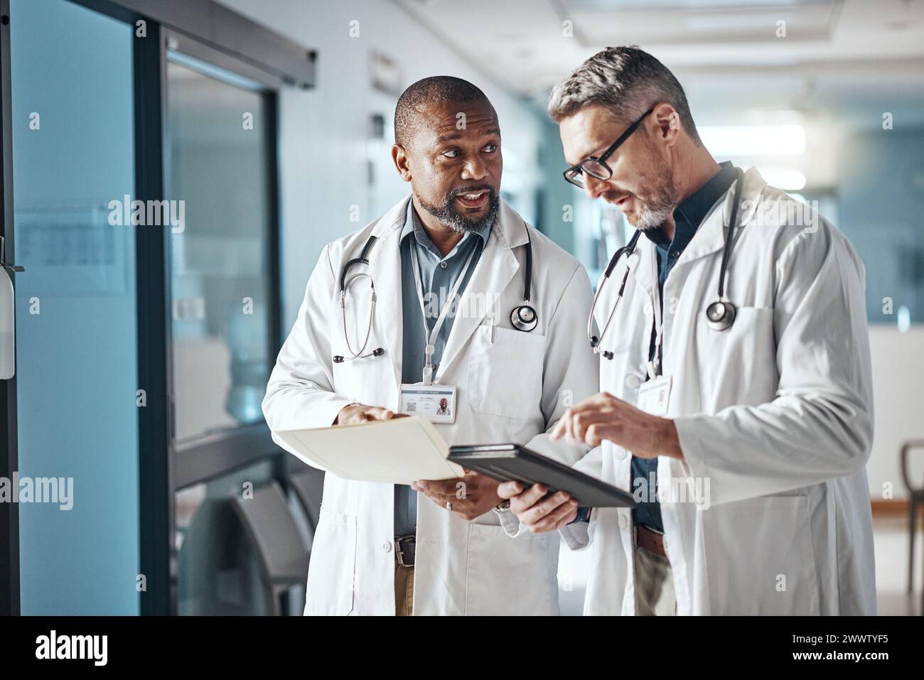 Hospital, teamwork and doctors with folder, tablet and brainstorming ...