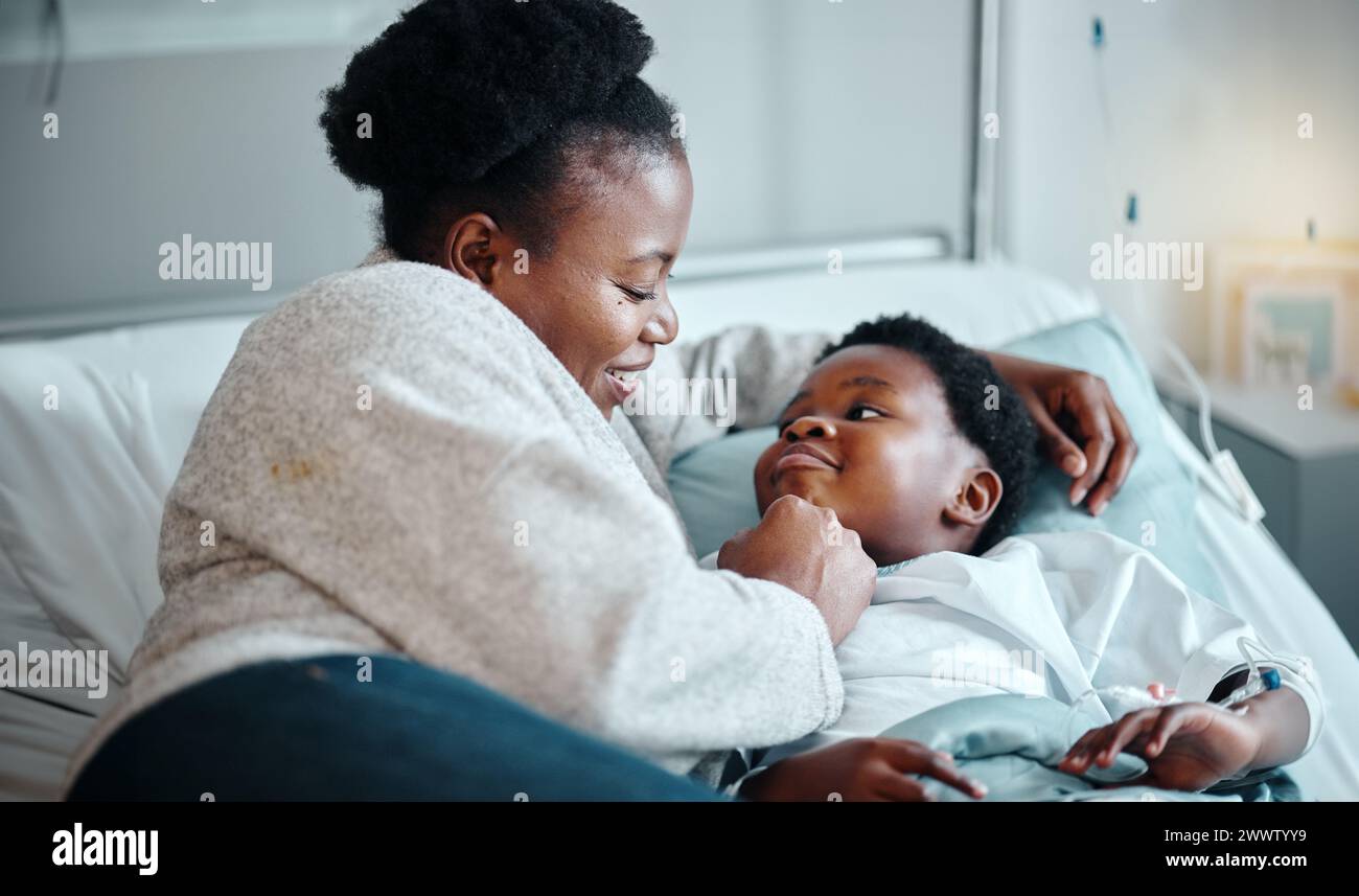 Hospital, bed and mother with girl for support or comfort for treatment ...