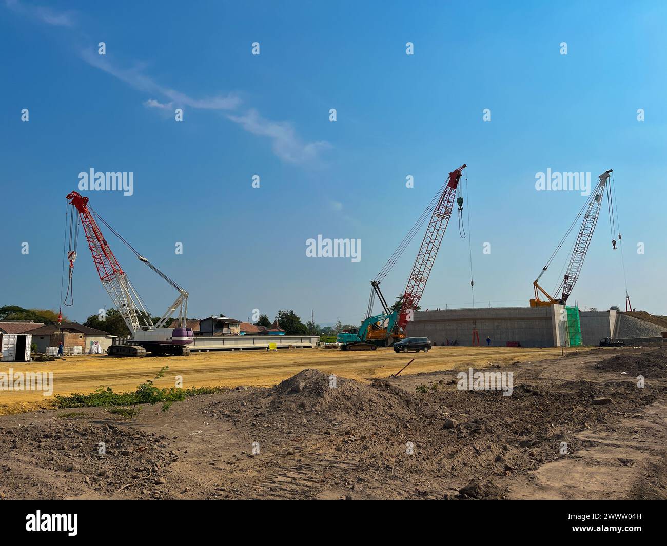 big Mobile cranes are lifting bridge trusses for transportation to be ...