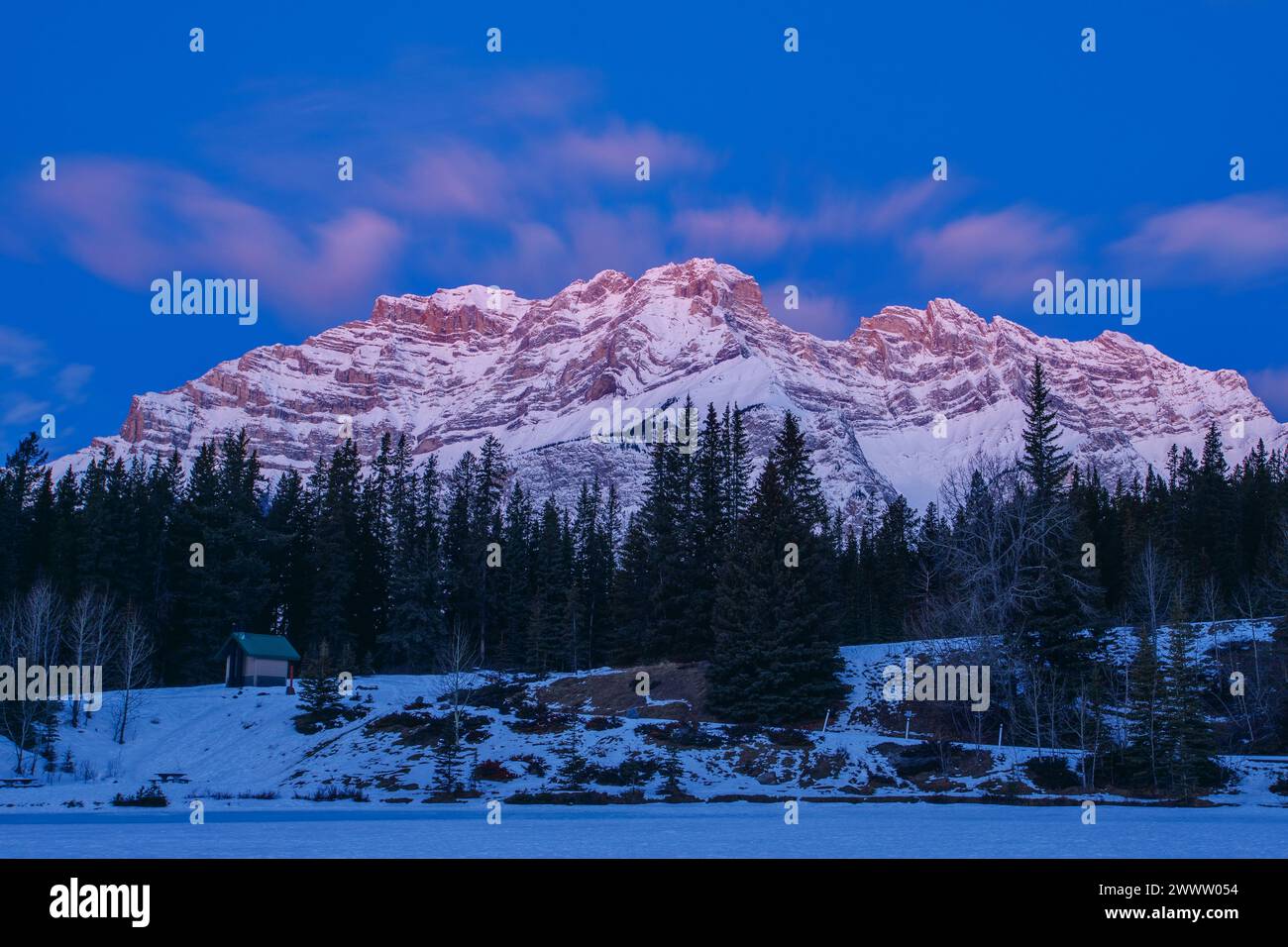 Sunrise over the eastern ridge of Cascade Mountain in the Winter as ...