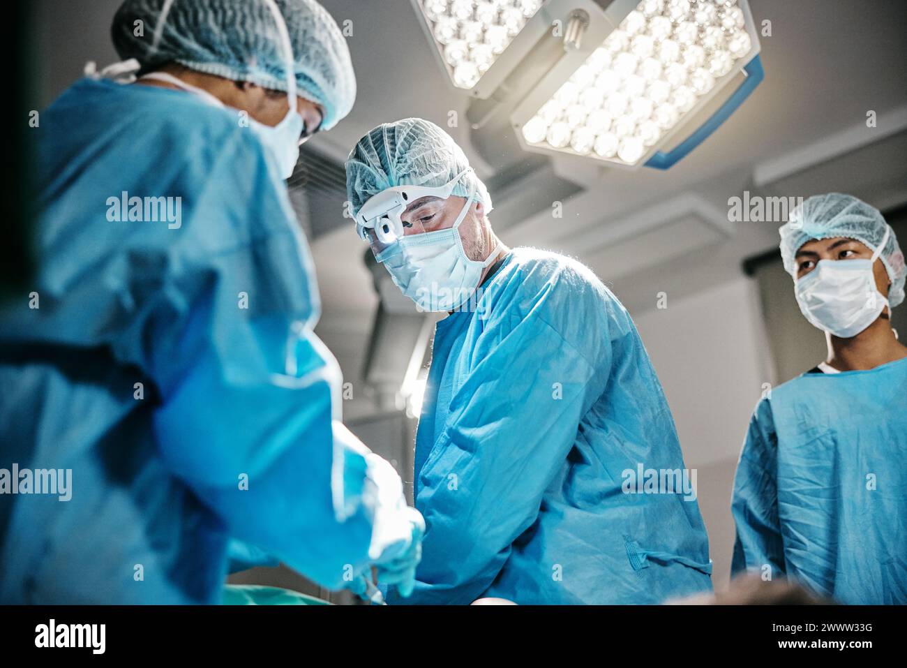 Theatre, icu or surgeons with teamwork for emergency, accident or ...