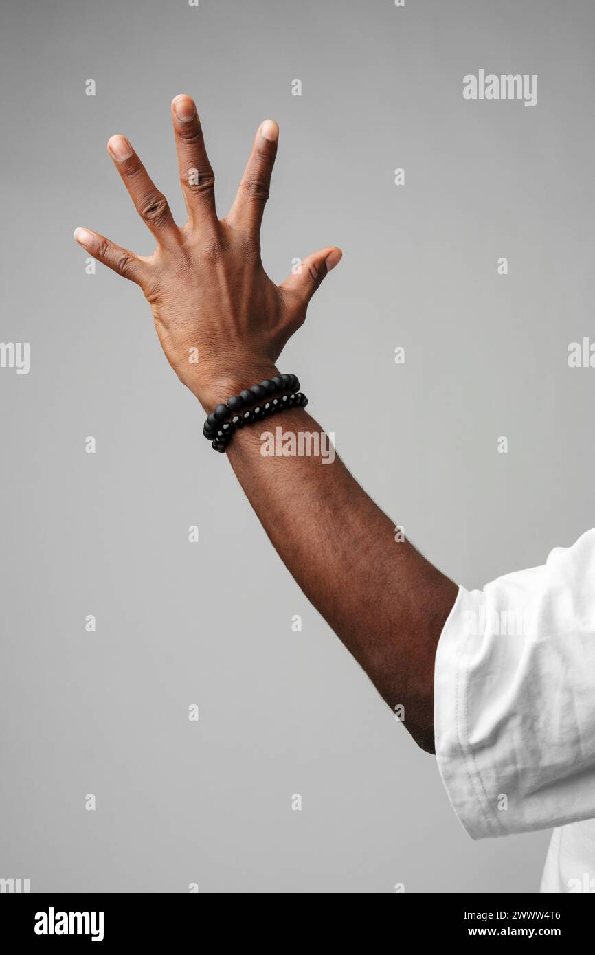 African Man Arm Raised in the Air Stock Photo - Alamy