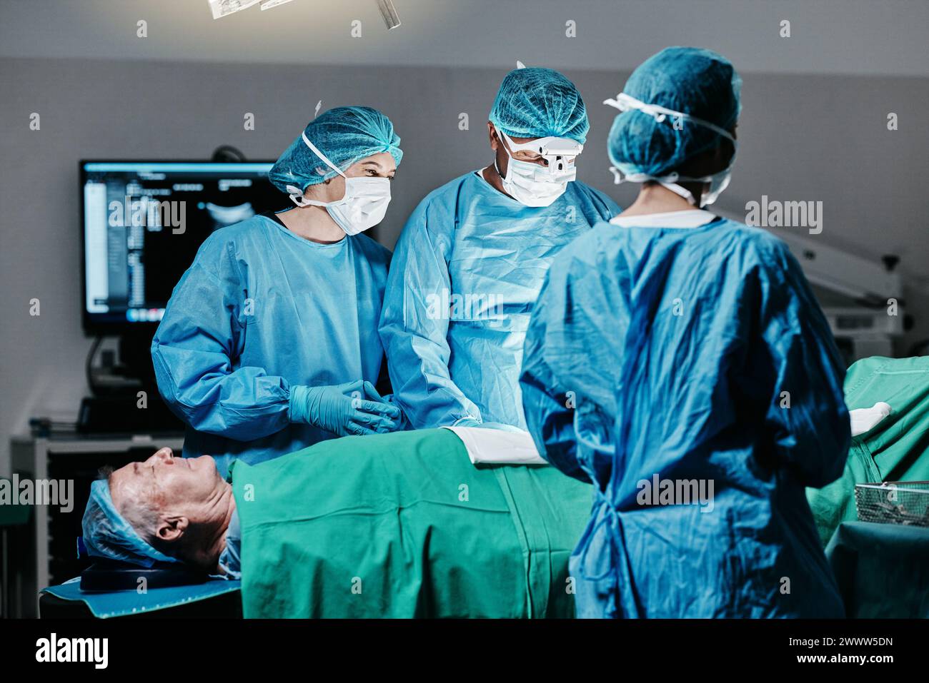 Healthcare, surgery and team of doctors with patient in theater for ...