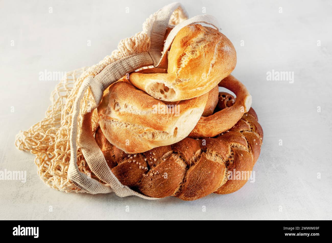 Assorted wheat and rye sourdough bread. Challah, braided bread ring ...
