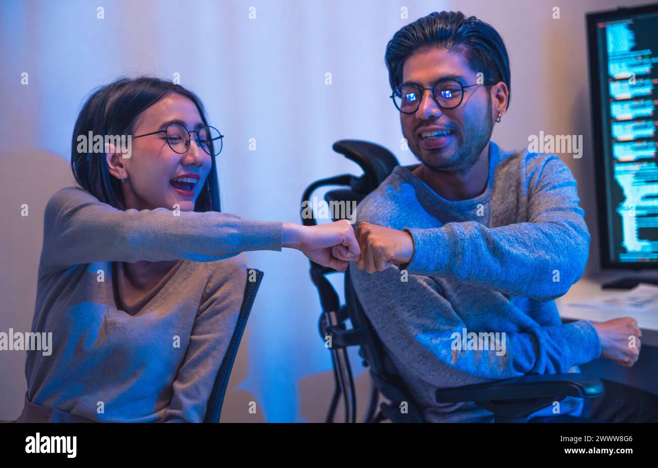 asian and Indian Developer team clapping hand for project success with ...
