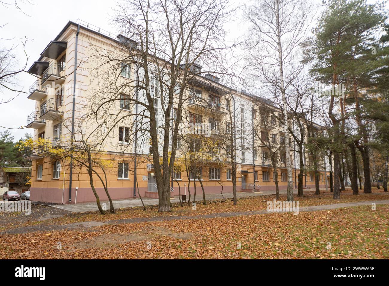 Apartment buildings and grounds nearby in fall Stock Photo - Alamy