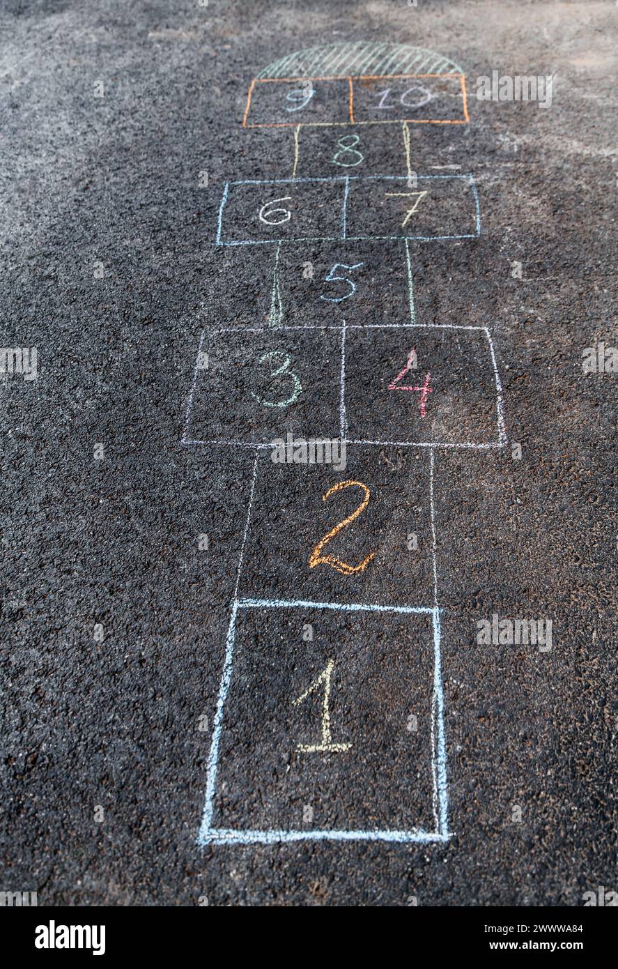 hopscotch chalk drawing on asphalt pavement Stock Photo - Alamy