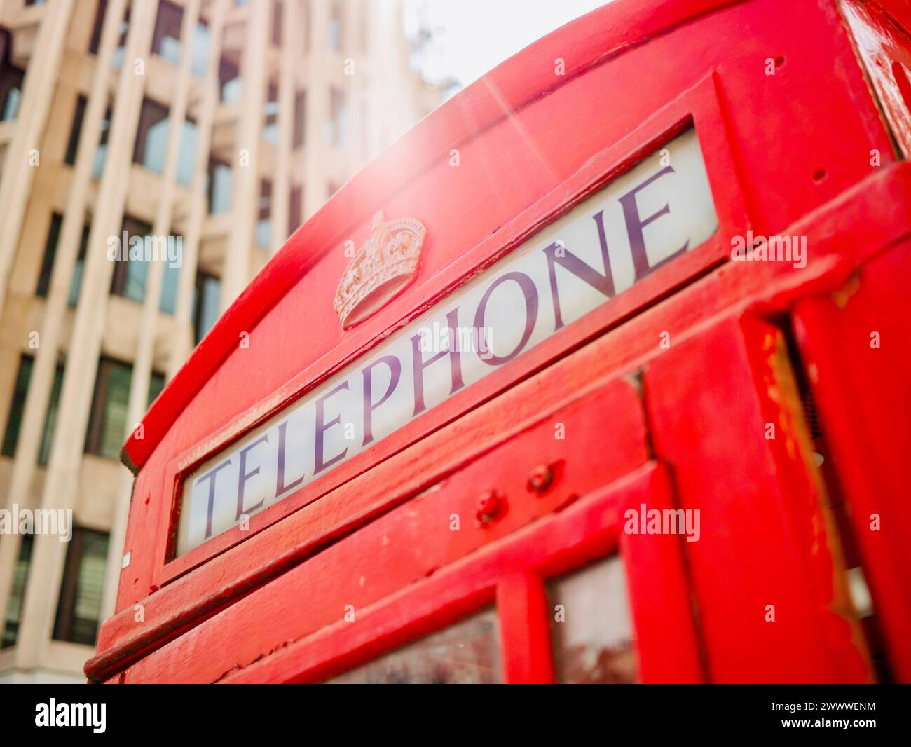London Telephone Booth, with the word telephone and sun flair with copy ...