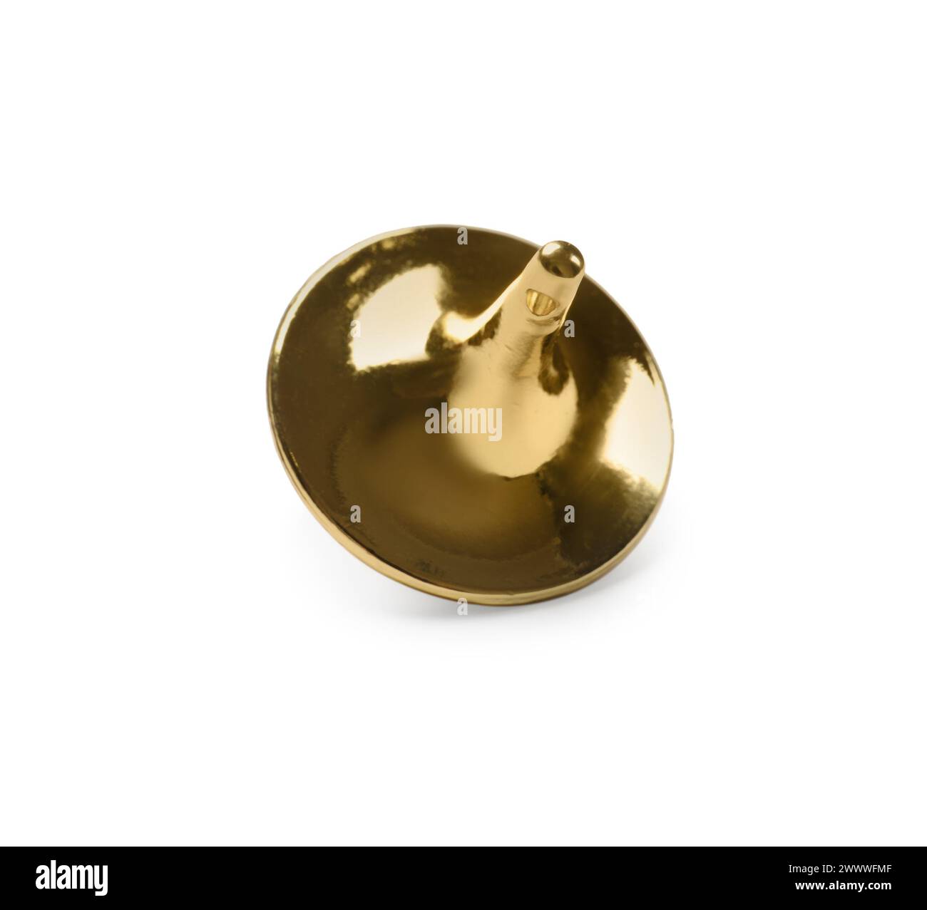 One golden spinning top on white background Stock Photo - Alamy