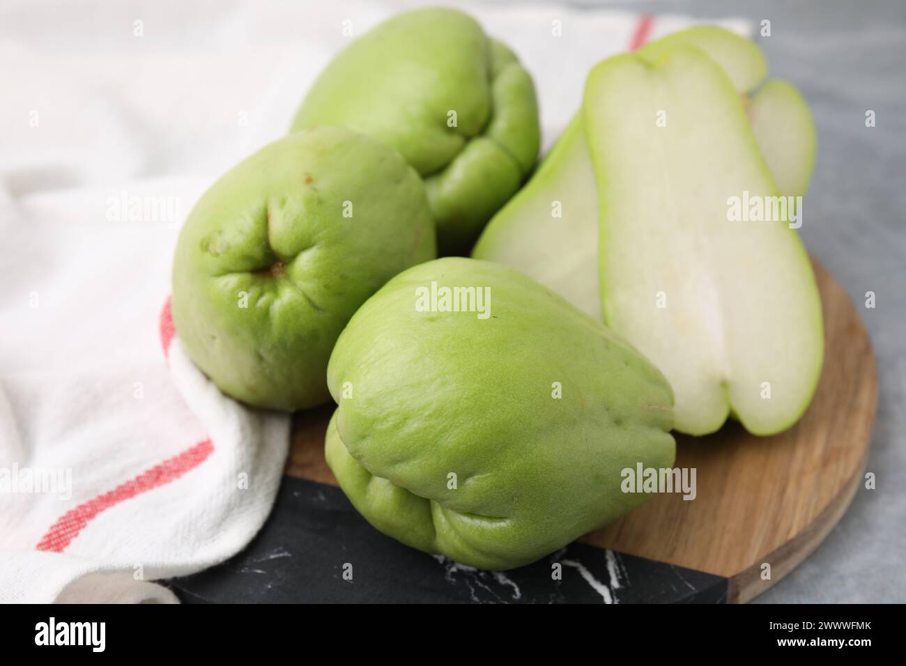 Cut and whole chayote on table, closeup Stock Photo - Alamy