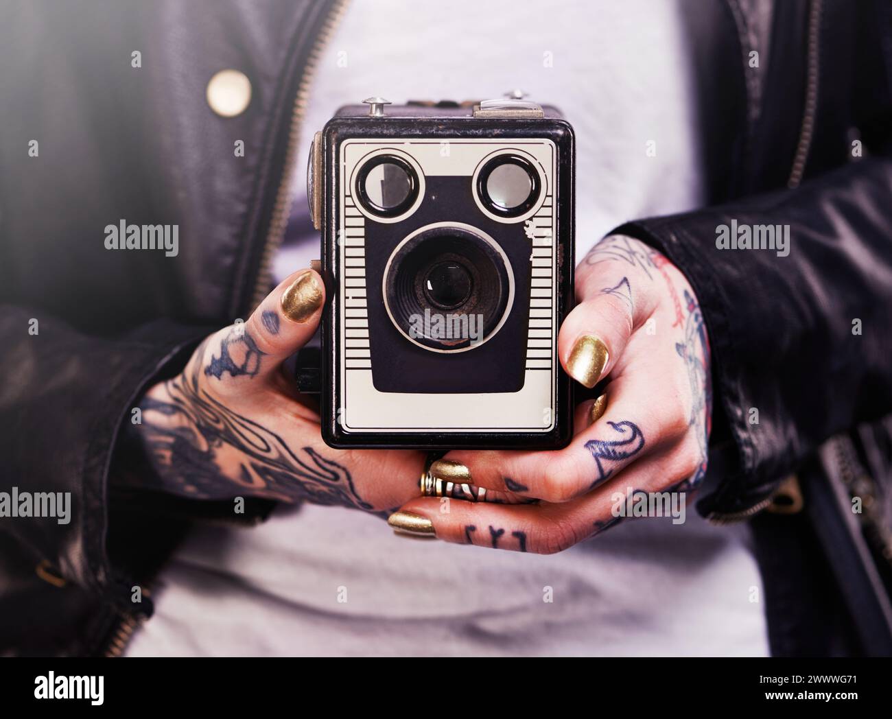Person, hands and tattoo with camera for vintage, polish and creative ...