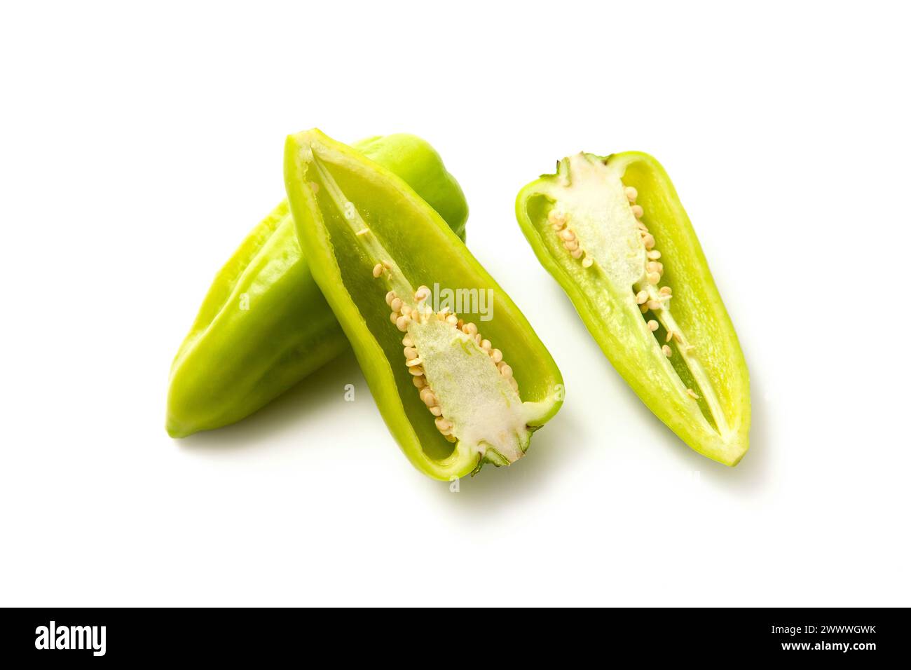 Whole and half of green bell pepper (capsicum) known as sweet bell ...