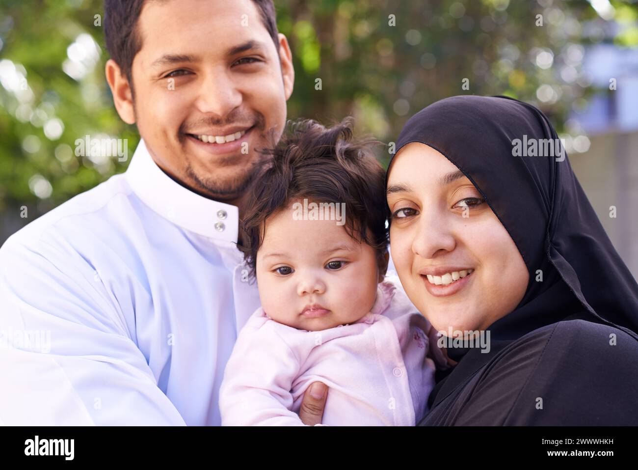 Muslim, family and portrait of parents with baby in park for bonding ...