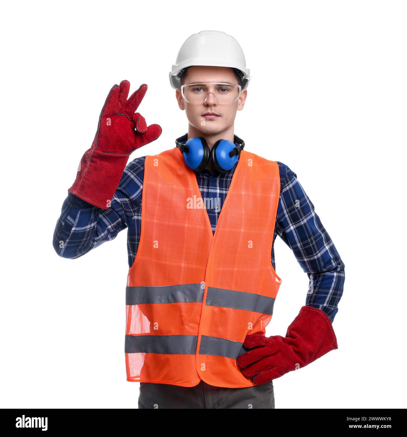 Young man wearing safety equipment and showing ok gesture on white ...