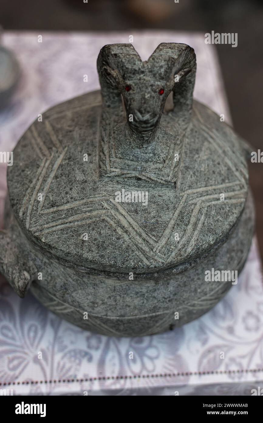 Stone box on a counter with ram statue Stock Photo - Alamy