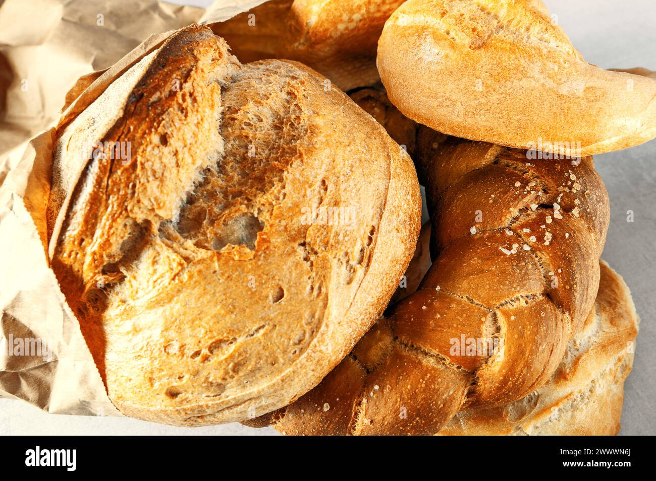 Assortment of bakery products. Challah, braided bread ring, kalachi ...