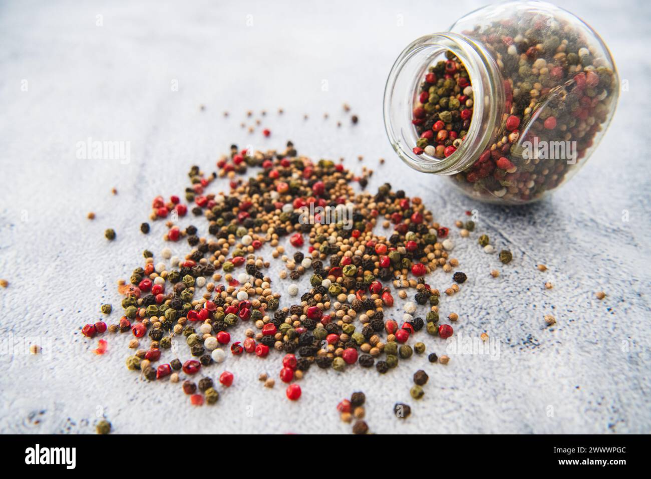 Spice jar of mix colourful pepper with coriander Stock Photo - Alamy