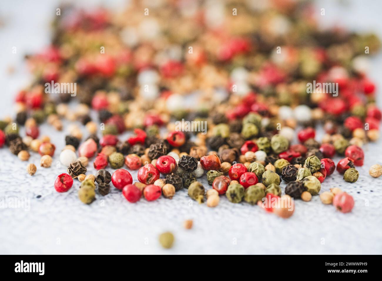 Close up texture mix colourful pepper with coriander Stock Photo - Alamy