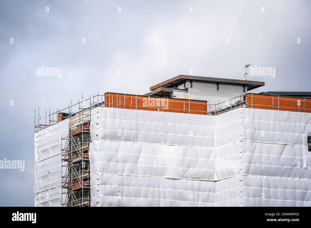 Flame retardant scaffold sheeting wrapped apartments building during ...