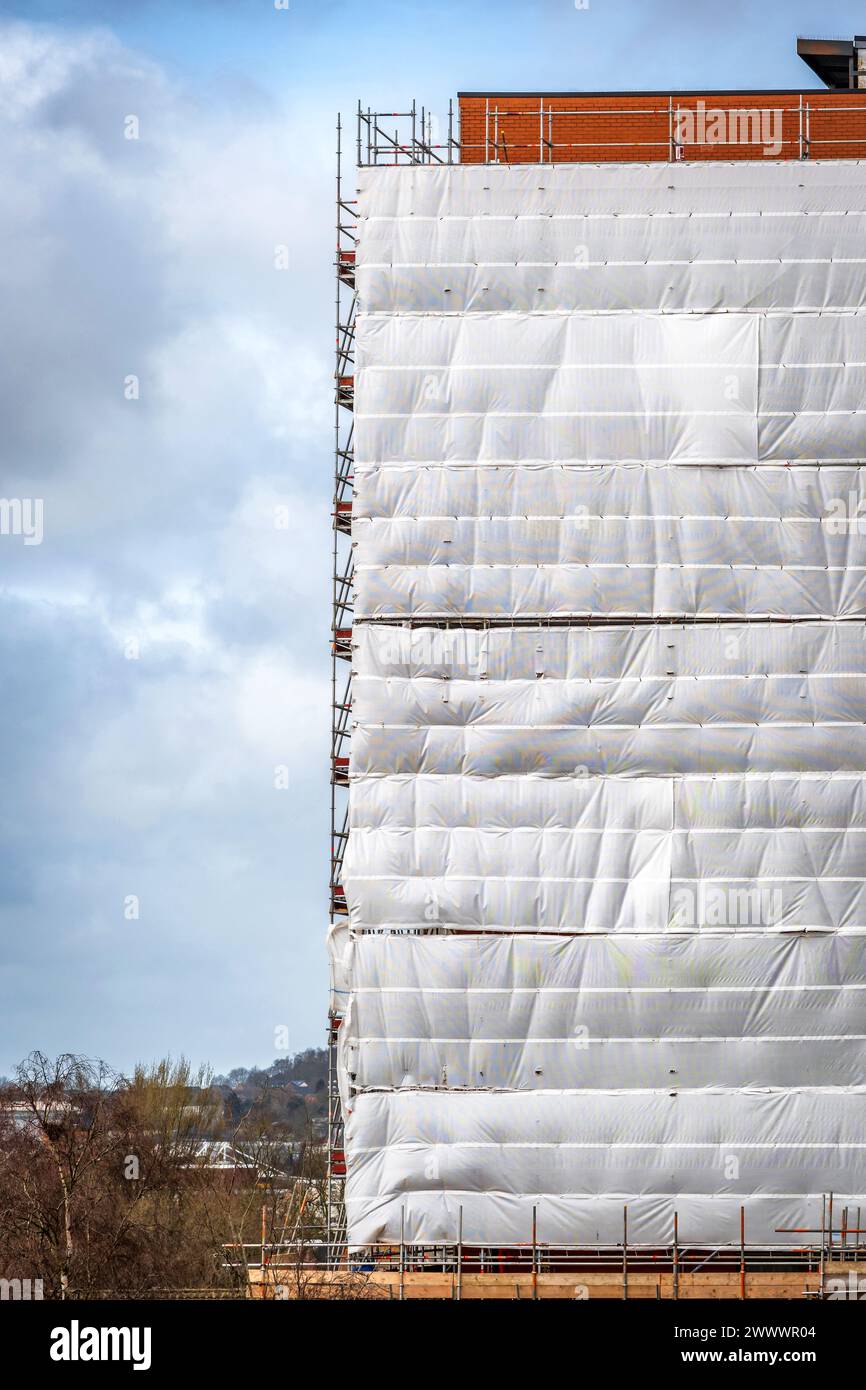 Flame retardant scaffold sheeting wrapped apartments building during ...