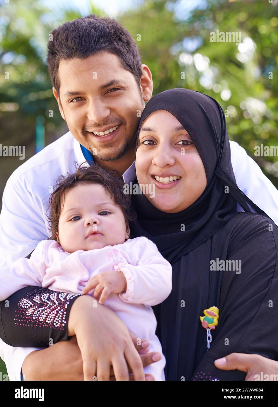 Muslim, park and portrait of parents with child for bonding, ramadan ...